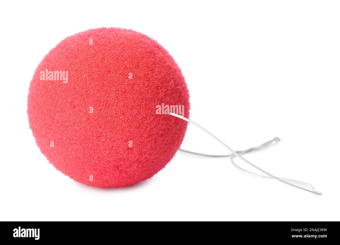 Red foam clown nose isolated on white Stock Photo - Alamy