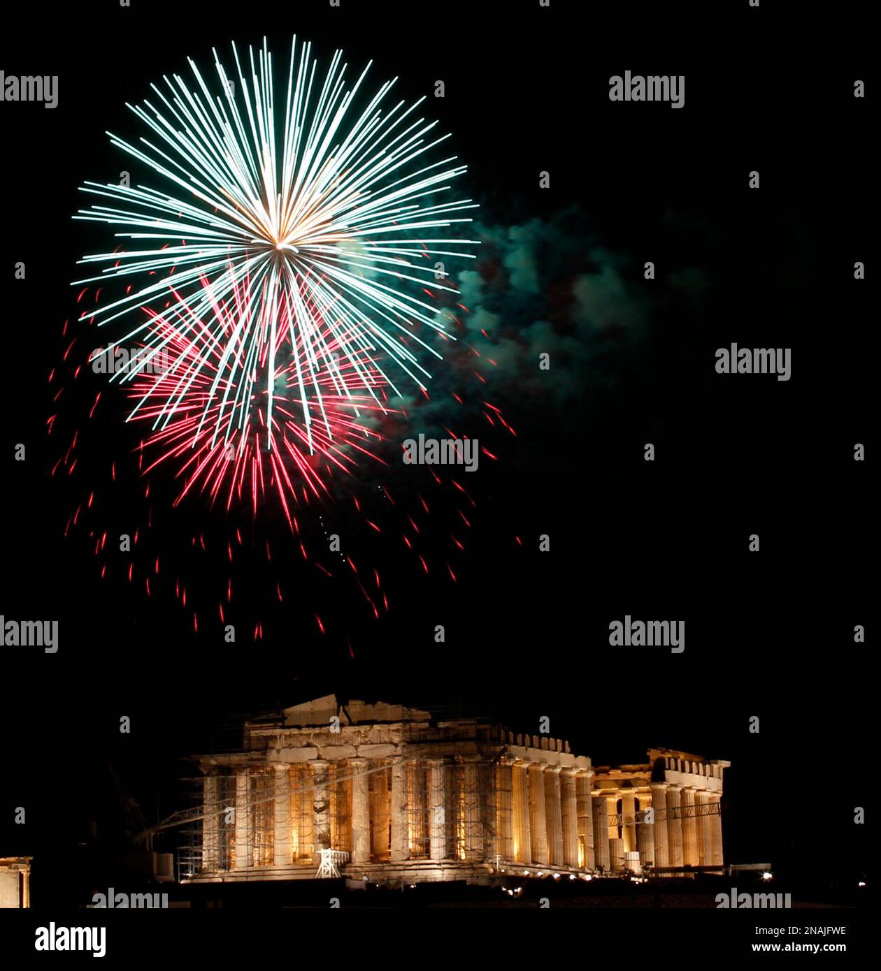 Fireworks explode over the ancient Acropolis Hill with the Parthenon ...