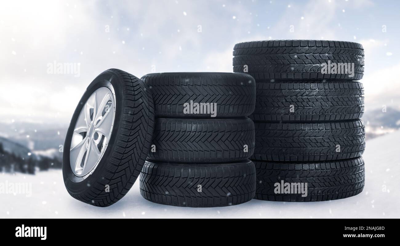 Set of wheels with winter tires outdoors on snow Stock Photo - Alamy