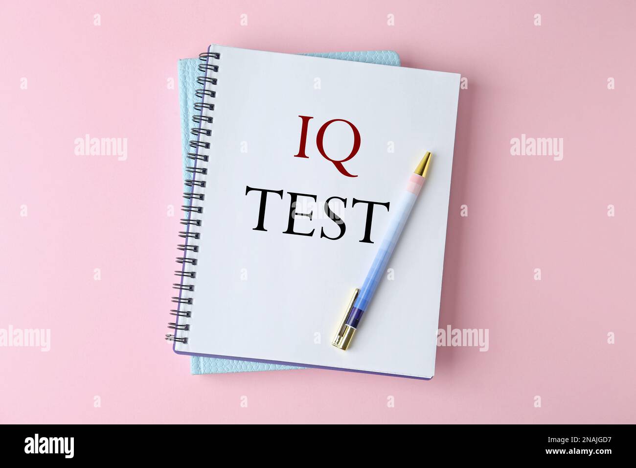 Notebook with text IQ Test and pen on pink background, top view Stock ...