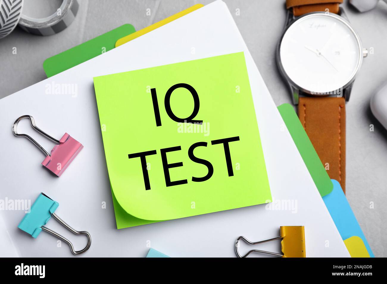 Sticky note with text IQ Test and stationery on table, flat lay Stock ...