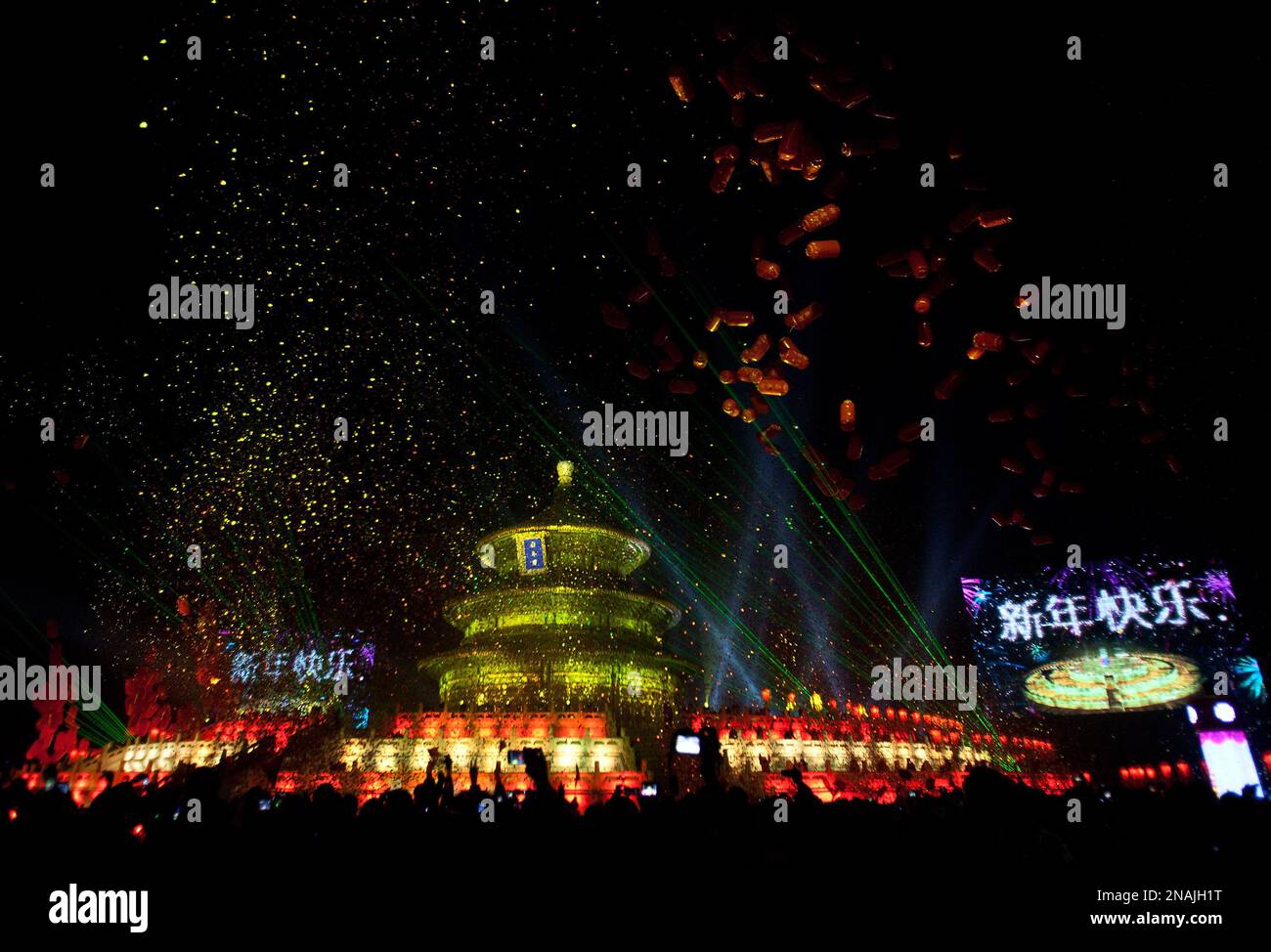 Visitors celebrate a light show at the Temple of Heaven during the New ...