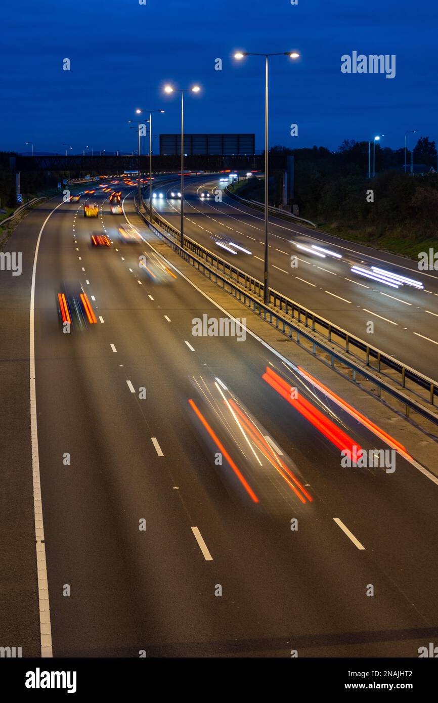 Fast moving traffic drives along the M5 motorway and highway road in UK ...
