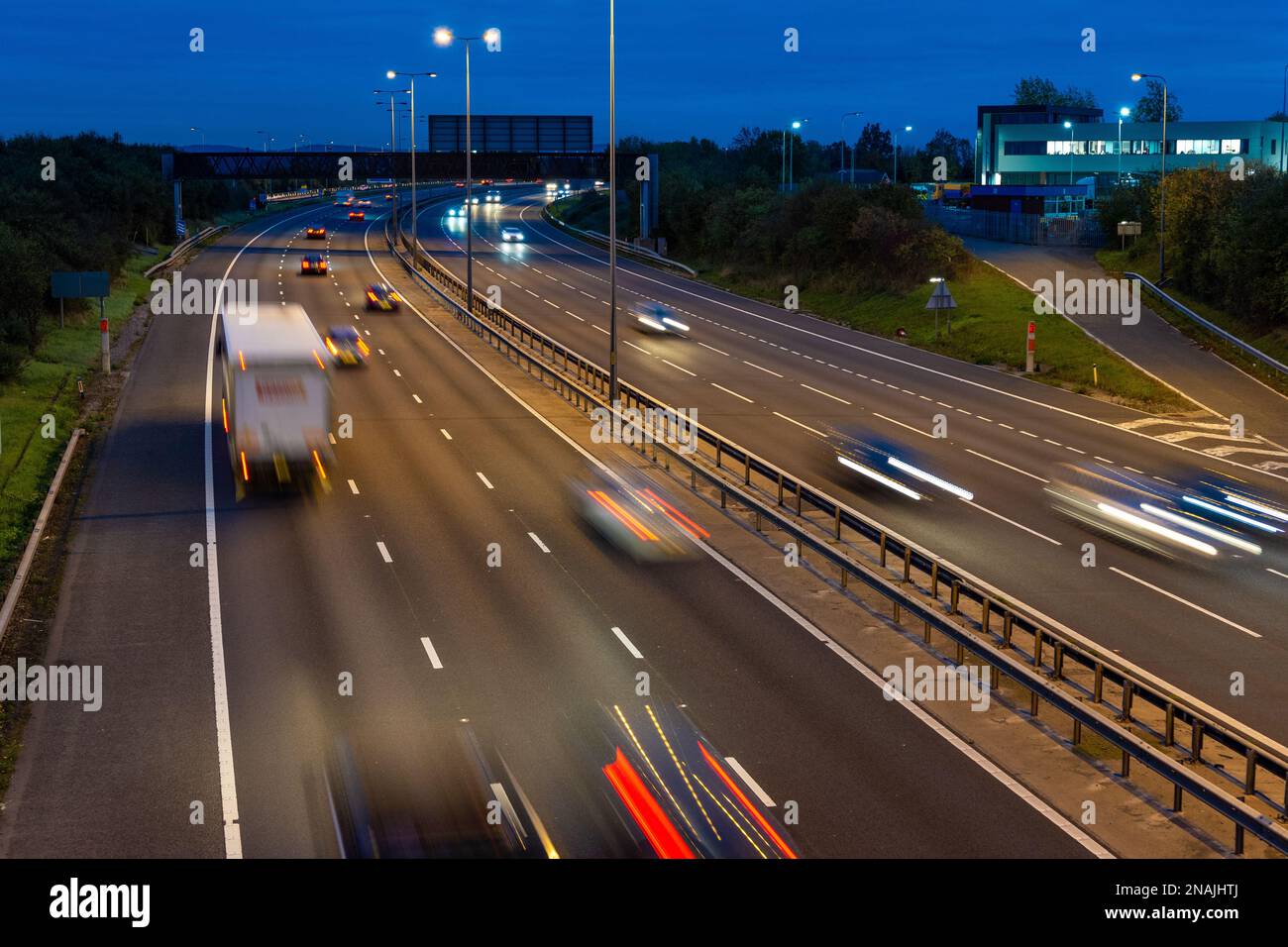 Fast moving traffic drives along the M5 motorway and highway road in UK ...
