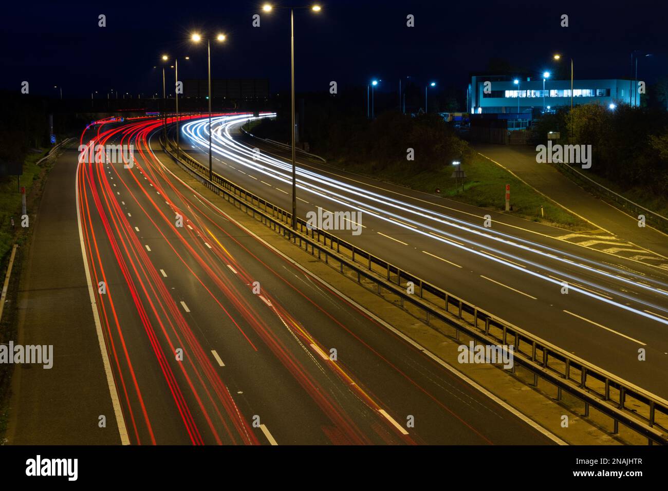 Fast moving traffic drives along the M5 motorway and highway road in UK ...
