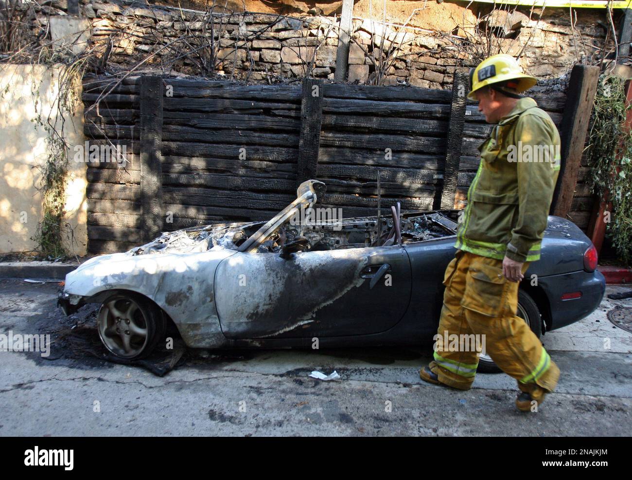 Los Angeles City firefighter Dane Jackson investigates the scene where ...