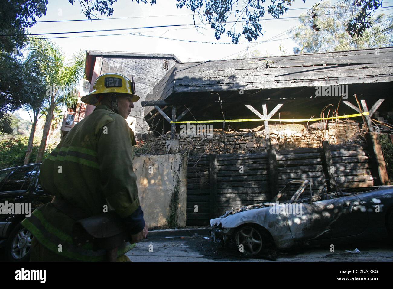 Los Angeles City firefighter Dane Jackson investigates the scene where ...