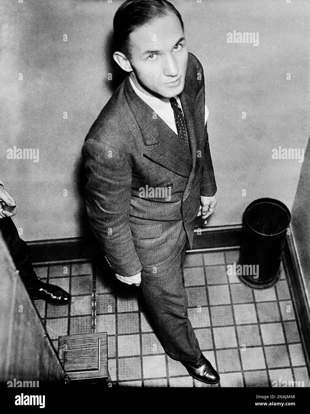 Bruno Richard Hauptmann at the bottom of a stairway in the courthouse ...