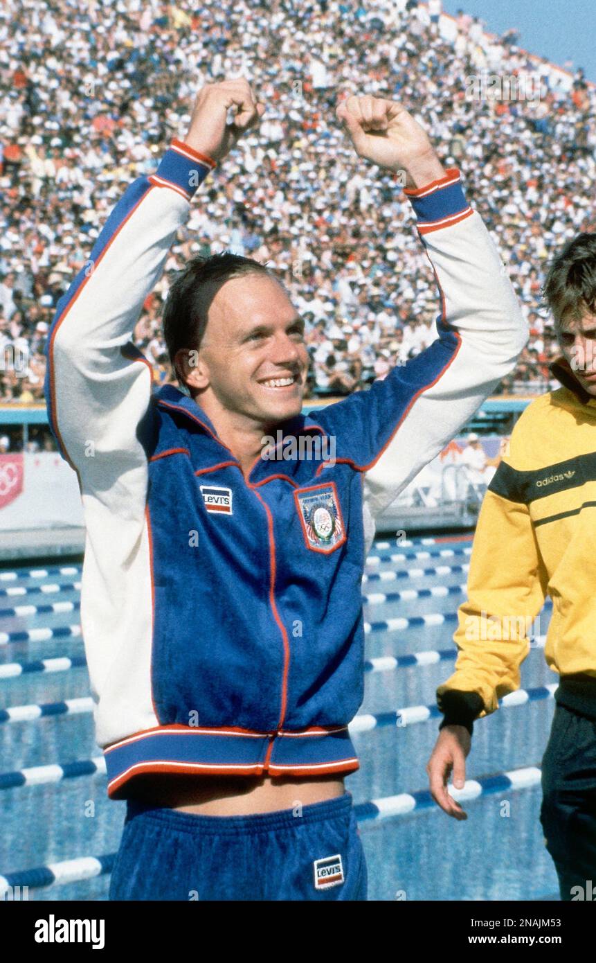 Ambrose Gaines IV, known as Rowdy Gaines raises his arms in victory ...