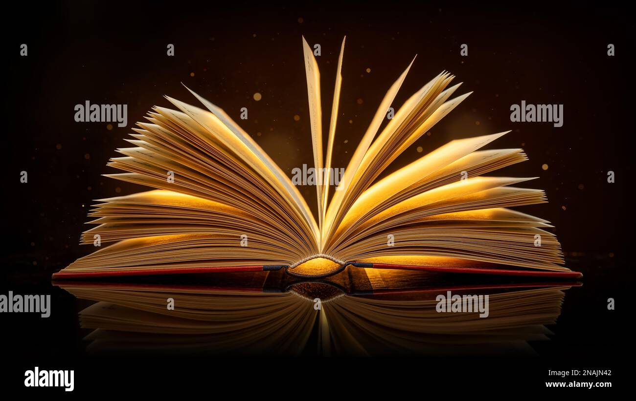 open book a against a black background Stock Photo - Alamy