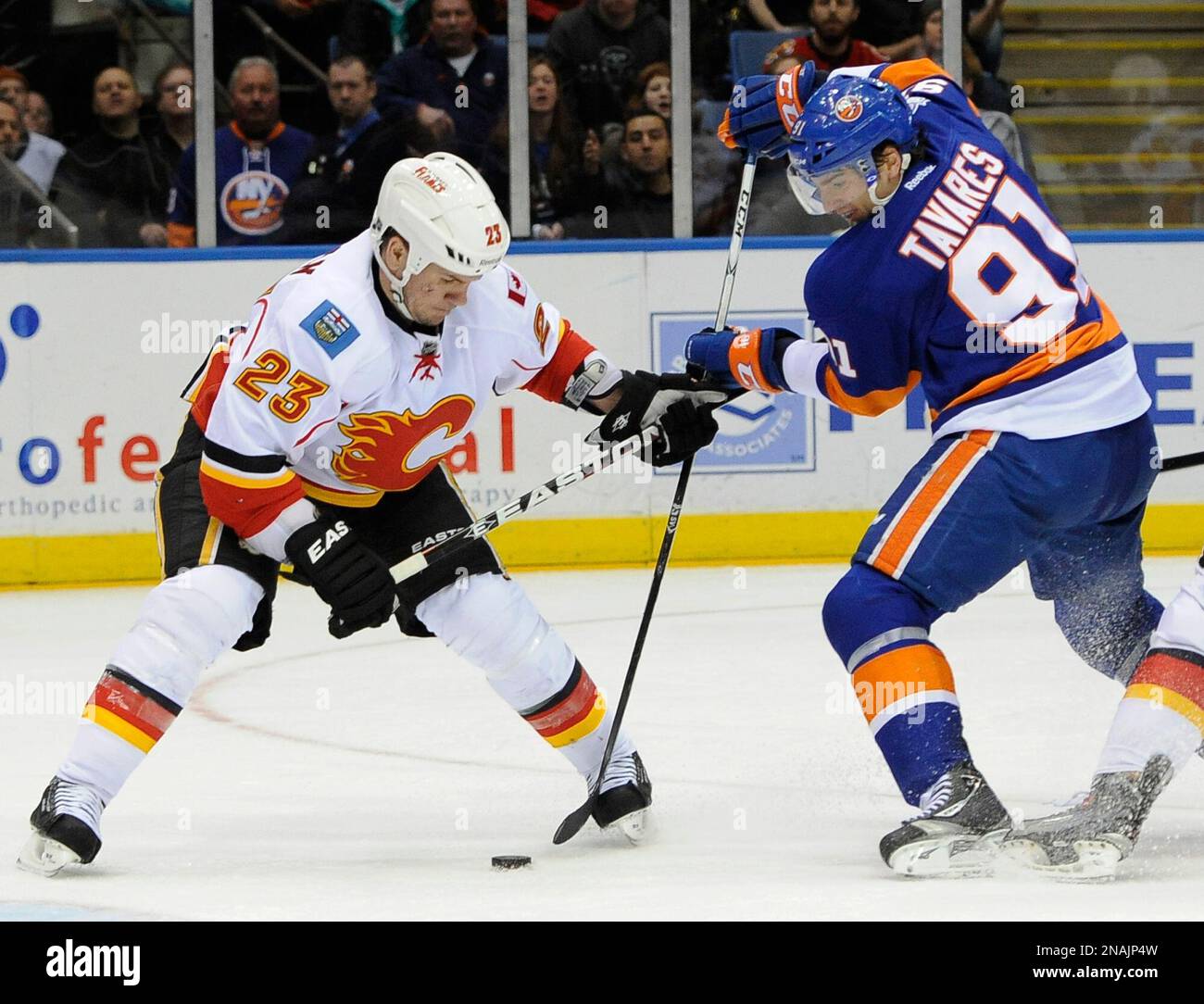 Calgary Flames' Scott Hannan (23) blocks New York Islanders' John ...