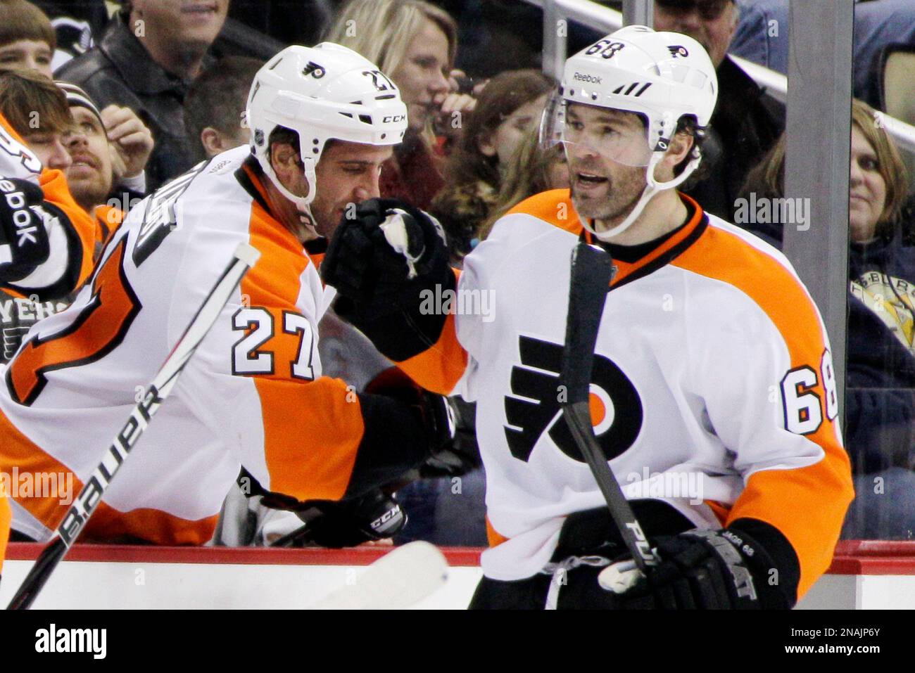 Philadelphia Flyers' Jaromir Jagr (68) is greeted by Max Talbot (27) as ...