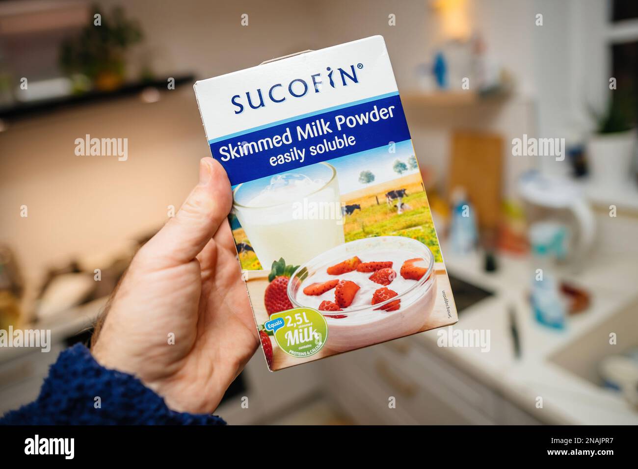 Germany - Jan 30, 2023: POV male hand holding package with Sucofin ...