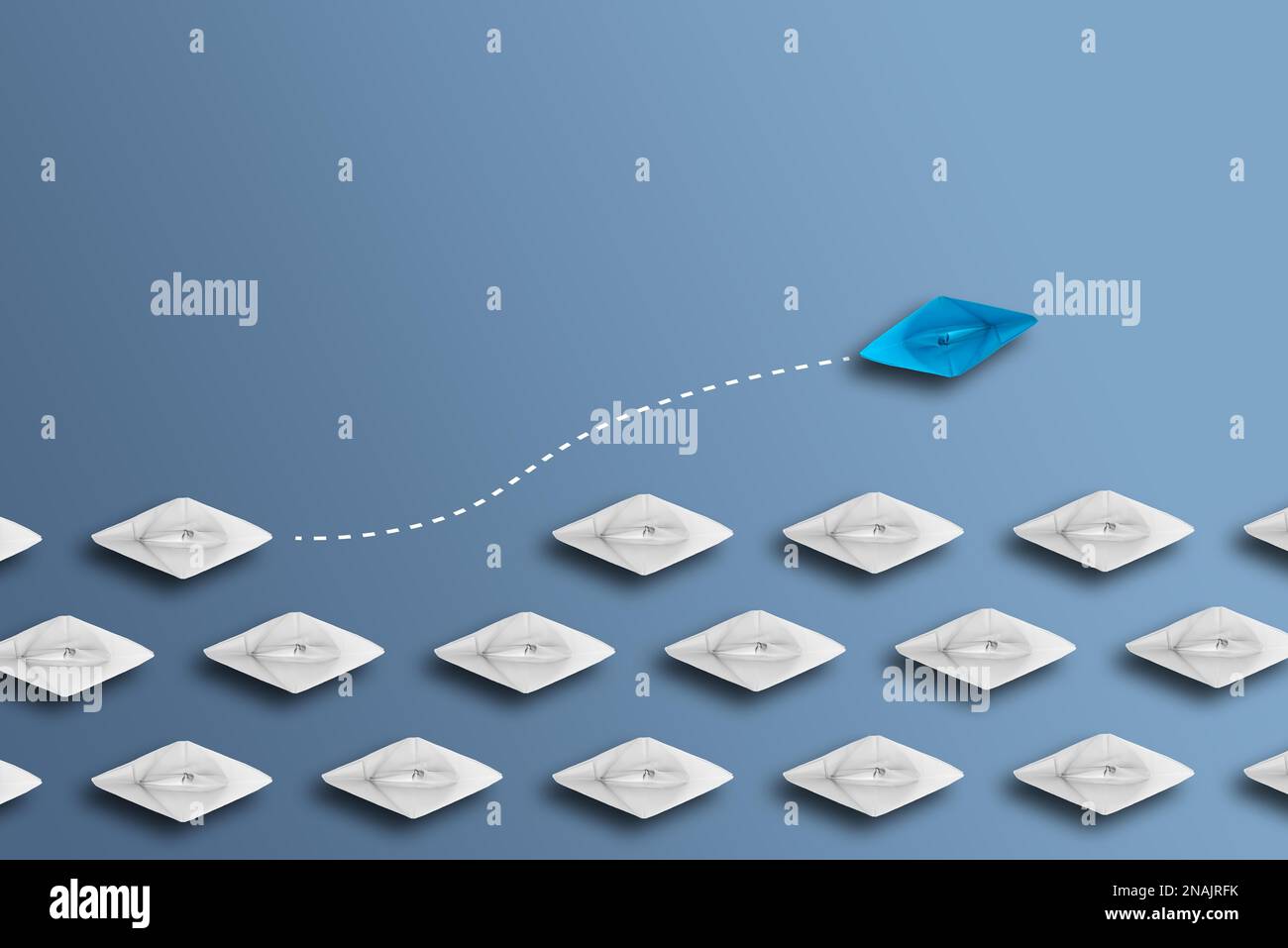 white paper boats in a row on blue background and one paperboat going ...