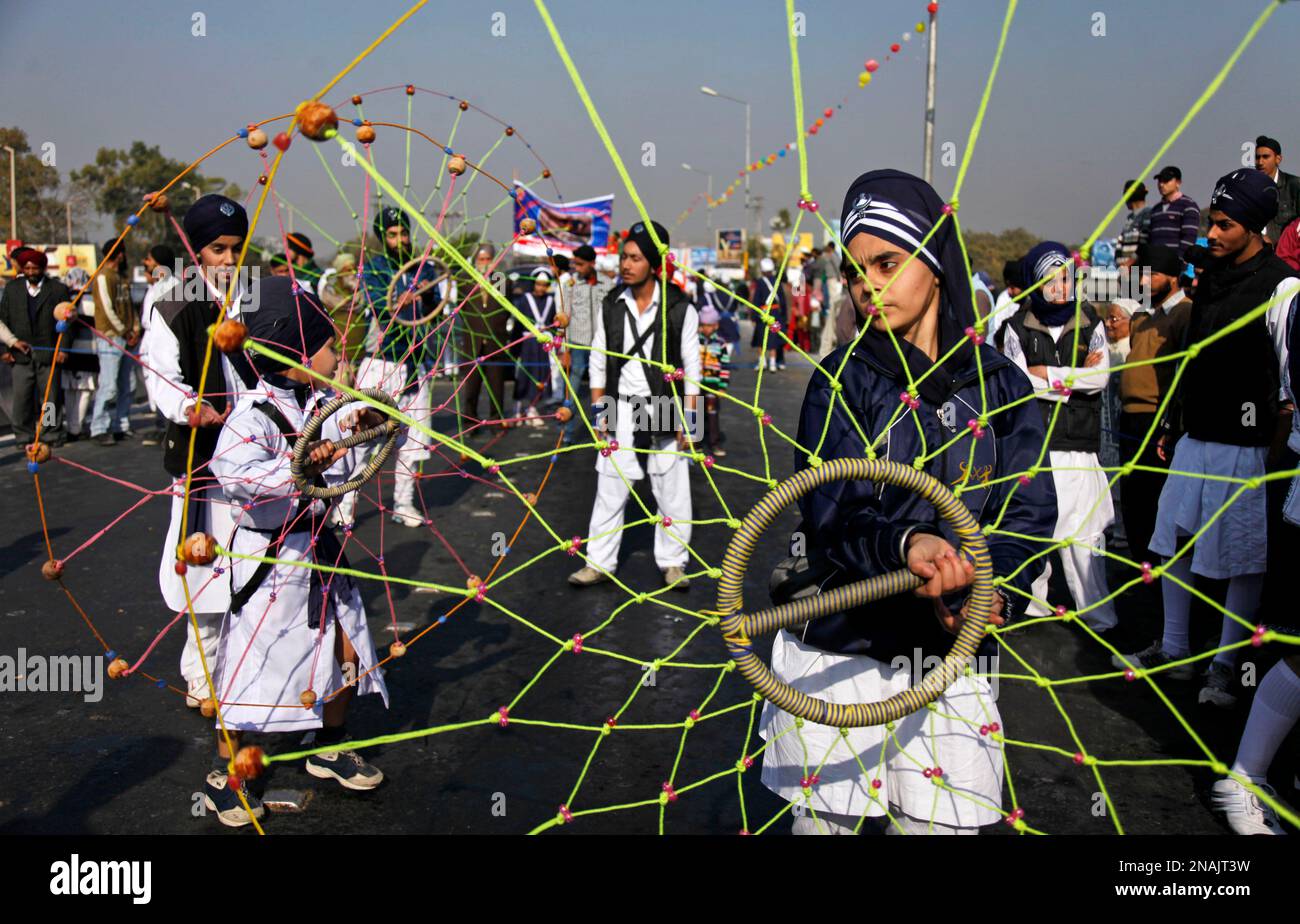 Sikh girls perform the Gatka, a traditional form of martial arts ...