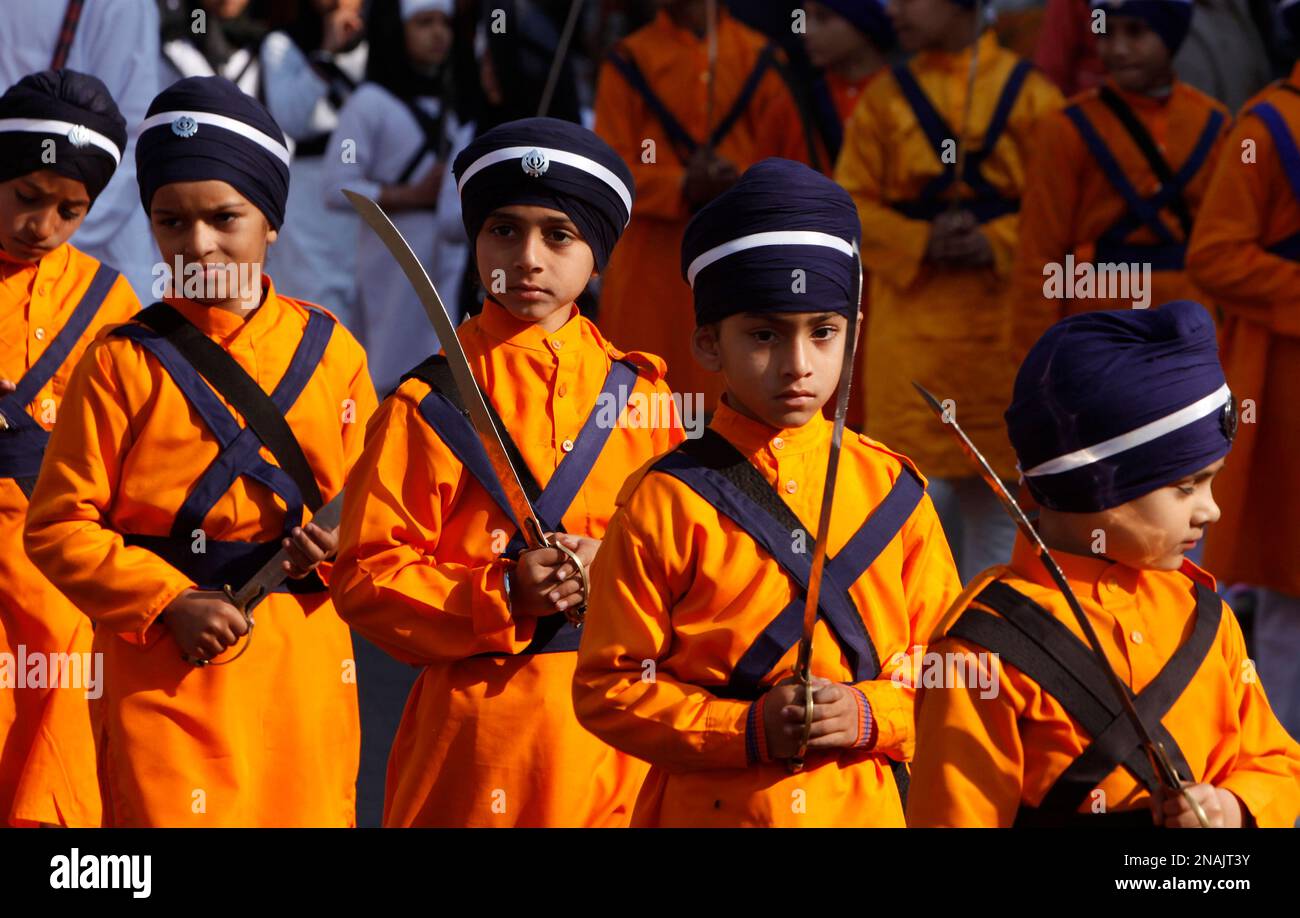 Sikh boys participate in a religious procession ahead of the birth ...