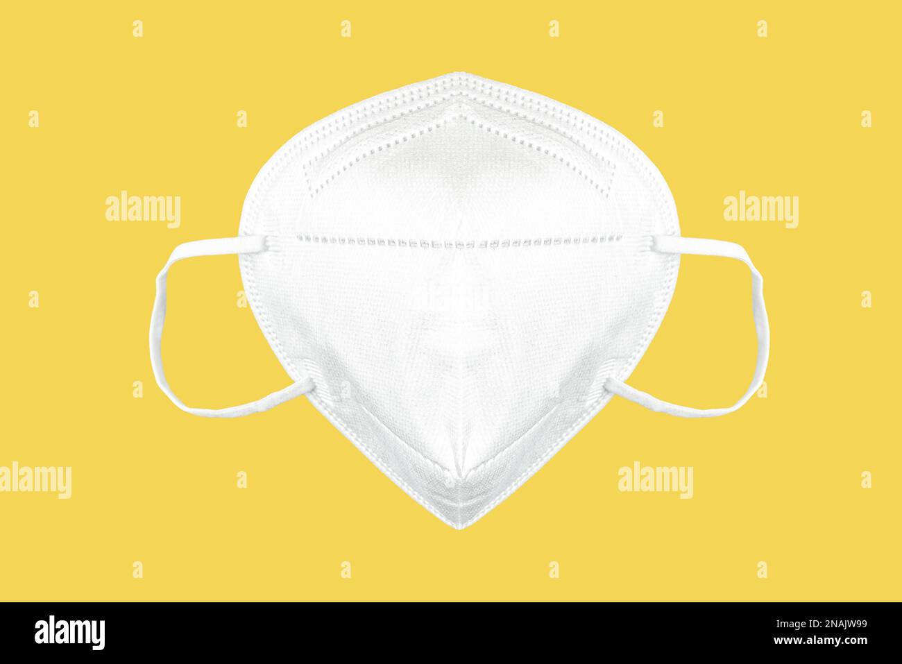 front view of FFP2 face mask, respirator isolated on yellow background ...