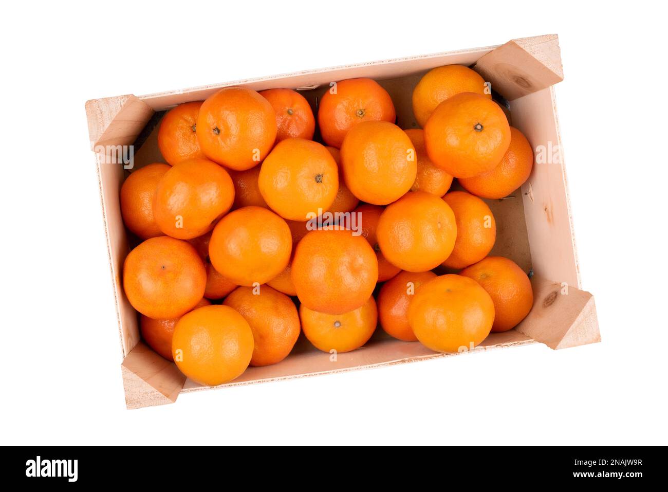 above view of wooden crate filled with tangerines or clementines ...