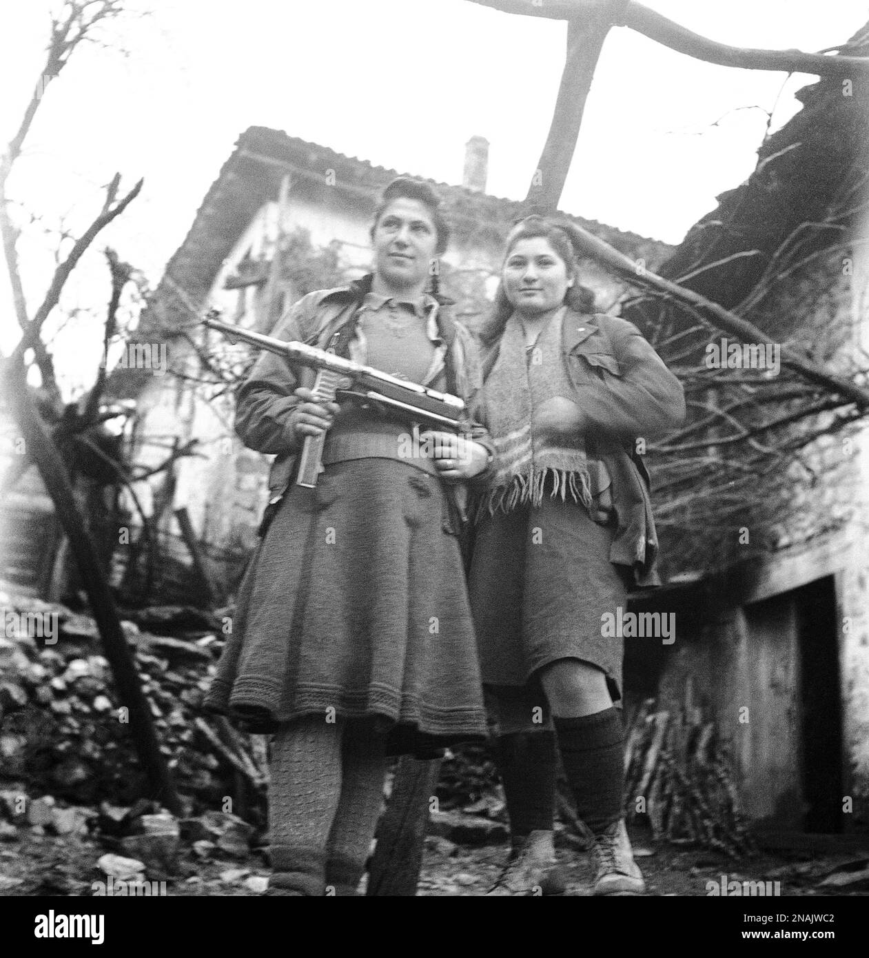 Two young partisan women stand guard near the headquarters of the Greek ...