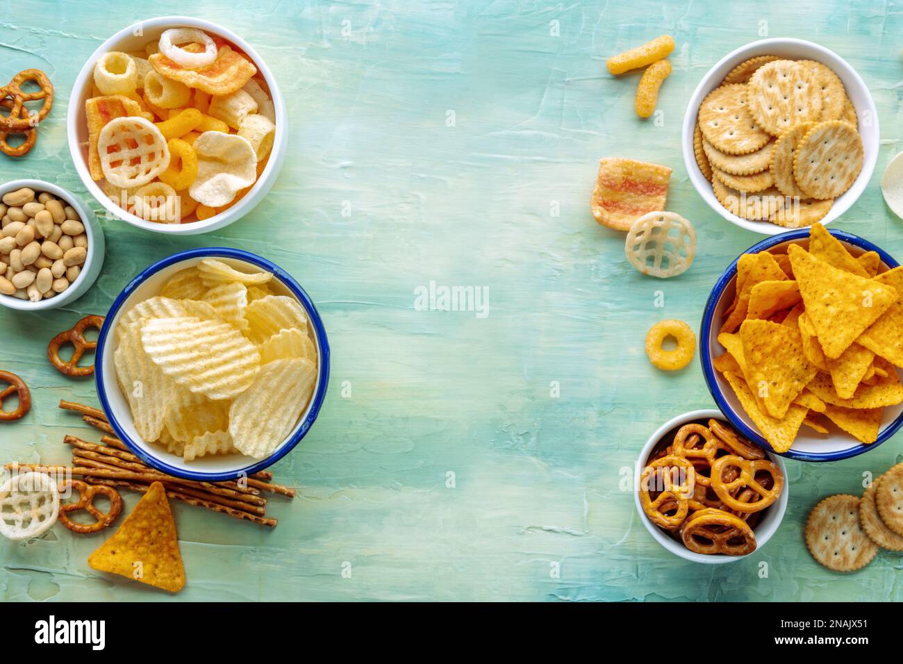 Salty snacks, overhead flat lay background with copy space. Party food ...