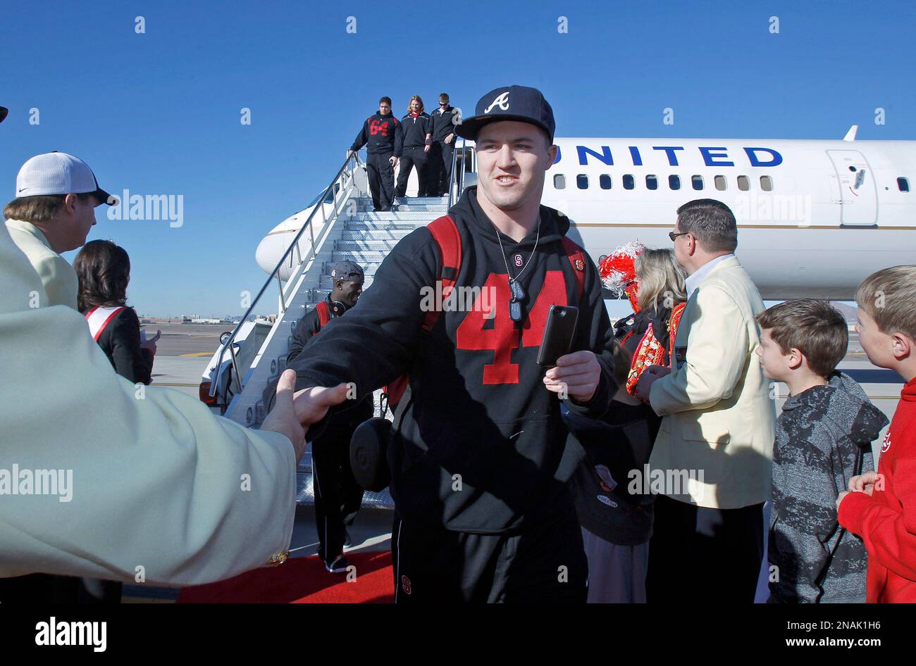 Stanford linebacker Chase Thomas, center, is greeted by Fiesta Bowl ...