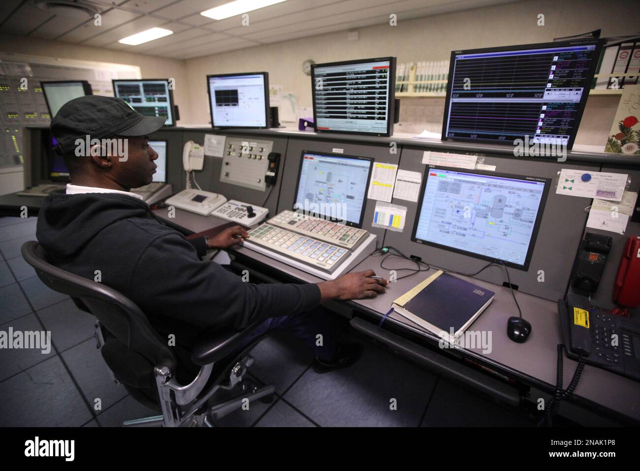 An unidentified shell worker is seen in the control room aboard the ...