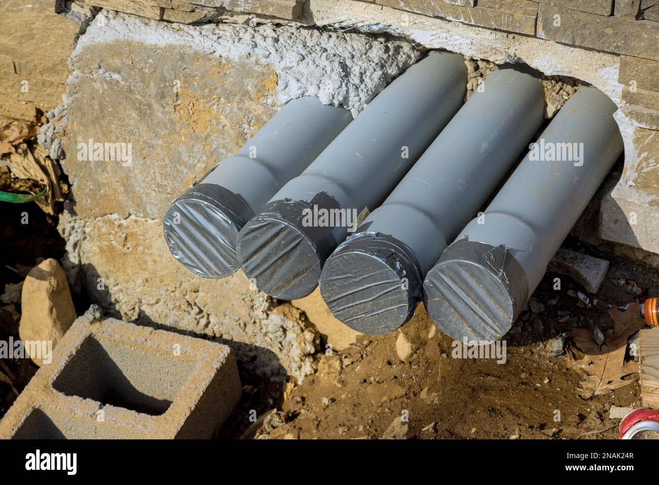 During assembly process new plastic sewer pipe is being installed in ...