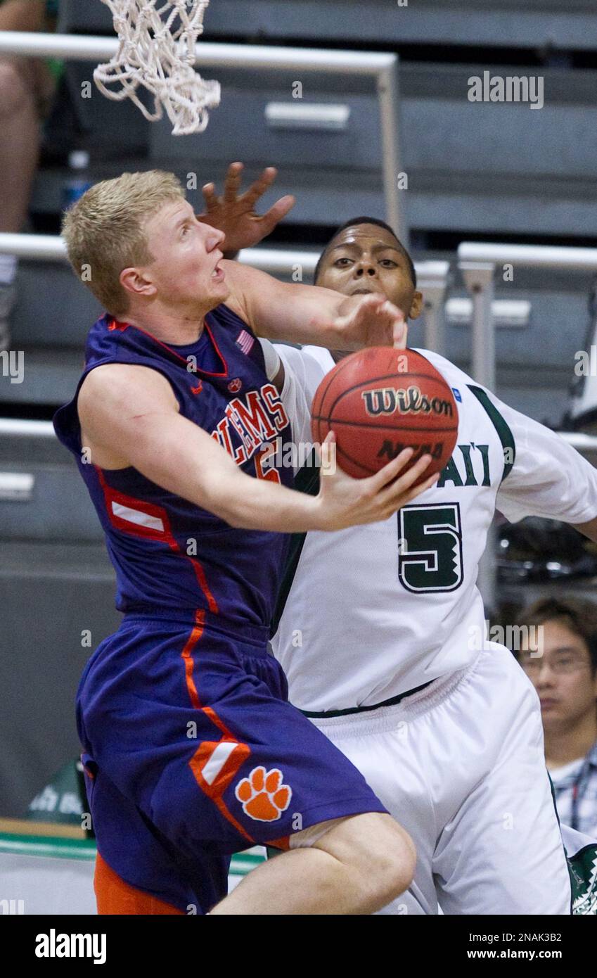 Clemson guard Tanner Smith (5) shoots a reverse layup as Hawaii forward ...