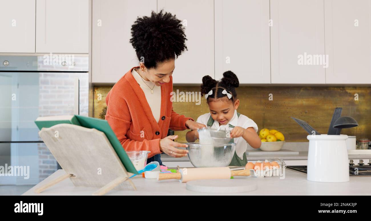 Cooking, learning and mother with girl in kitchen for cake, health and ...