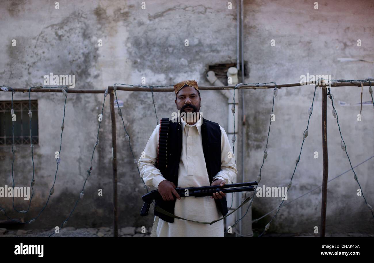 Pakistani private security guard Anwar Bouta poses for a photo while ...