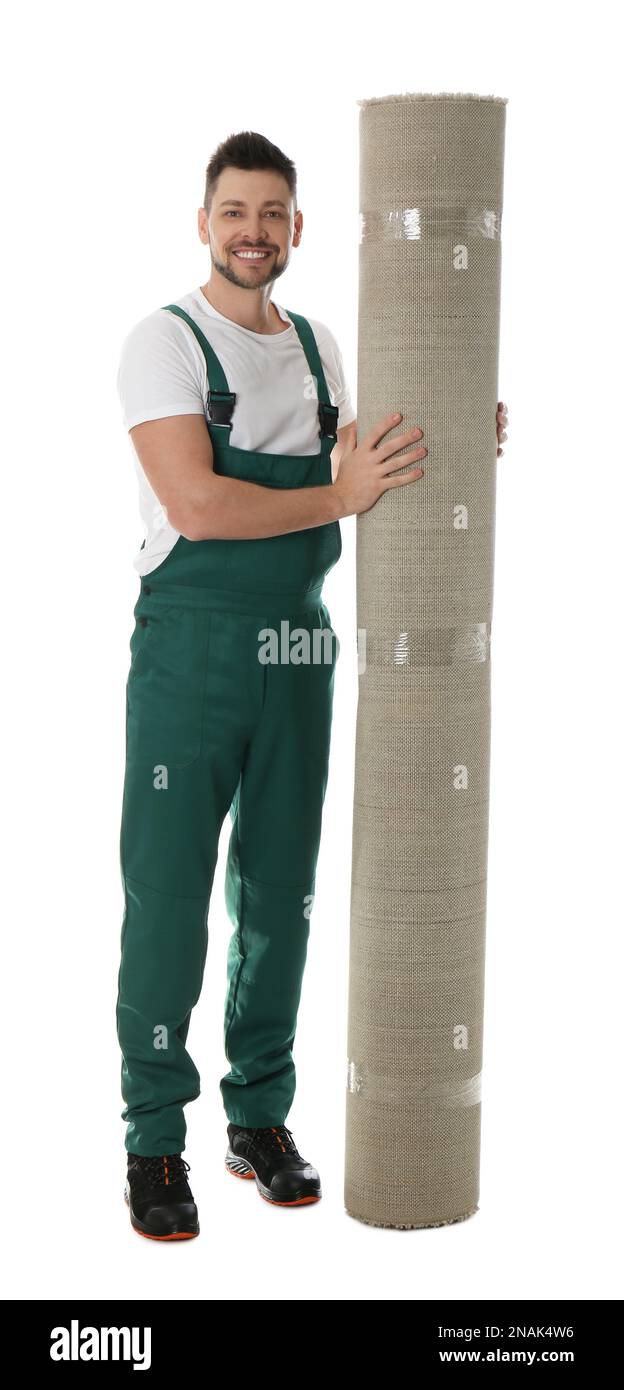 Male worker with rolled carpet on white background Stock Photo - Alamy