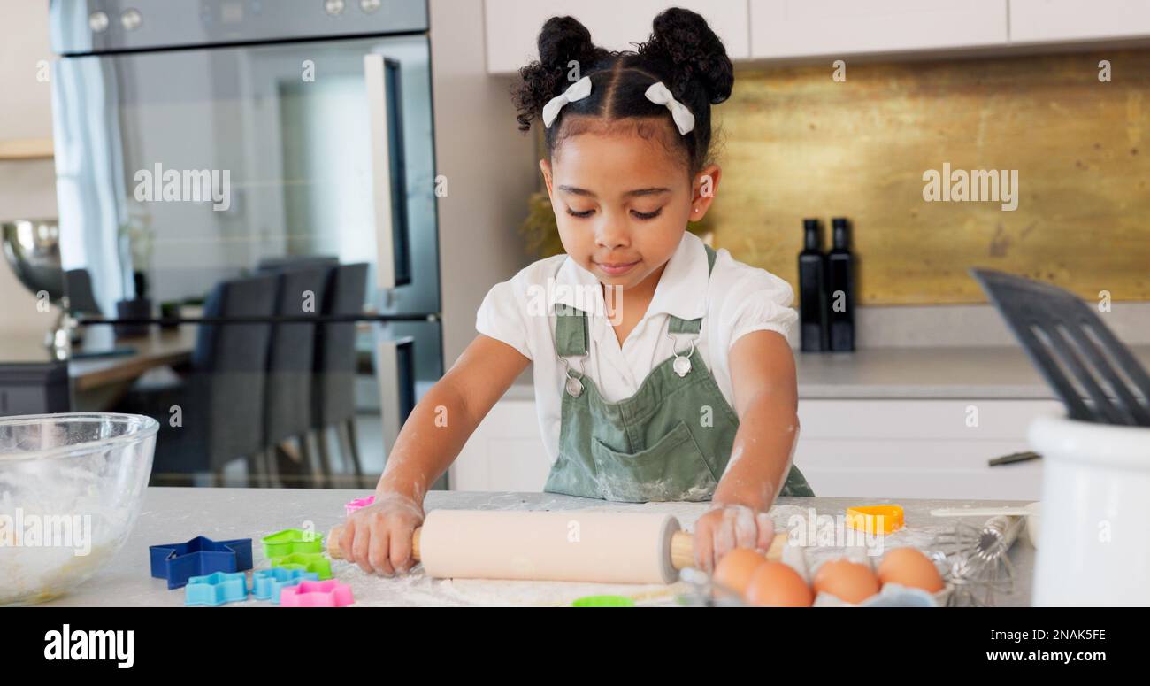 Happy girl kids baking cookies with rolling pin in kitchen, house and ...