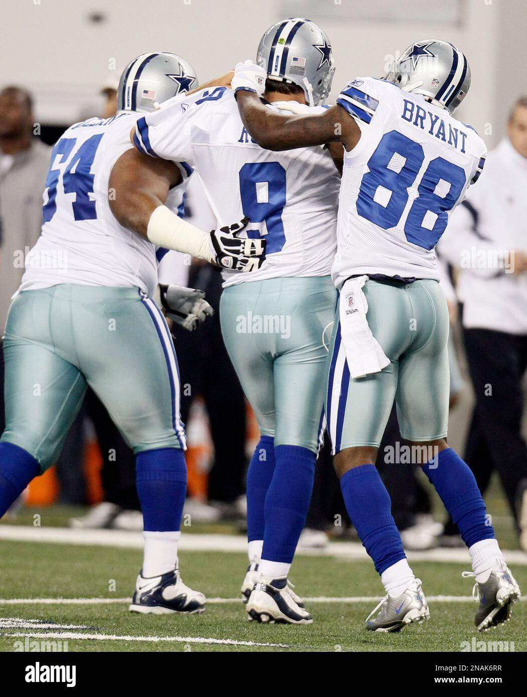 Dallas Cowboys quarterback Tony Romo, center, is helped from the field ...