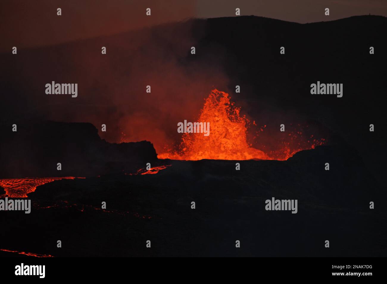 Active volcano spewing lava into the sky, night shot, Fagradalsfjall ...