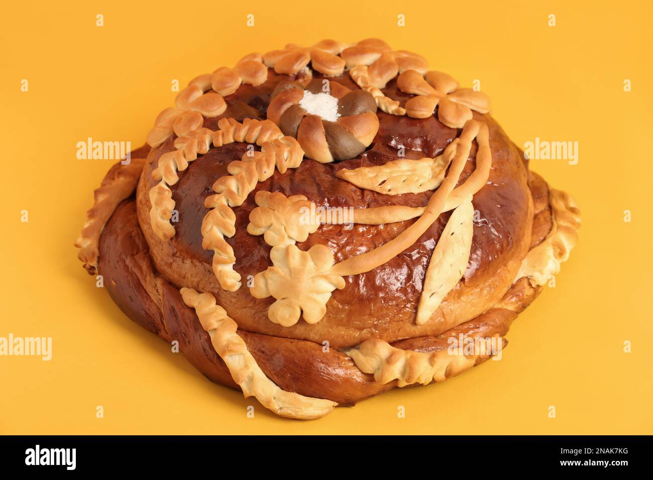 Fresh korovai on yellow background, closeup. Ukrainian bread and salt ...