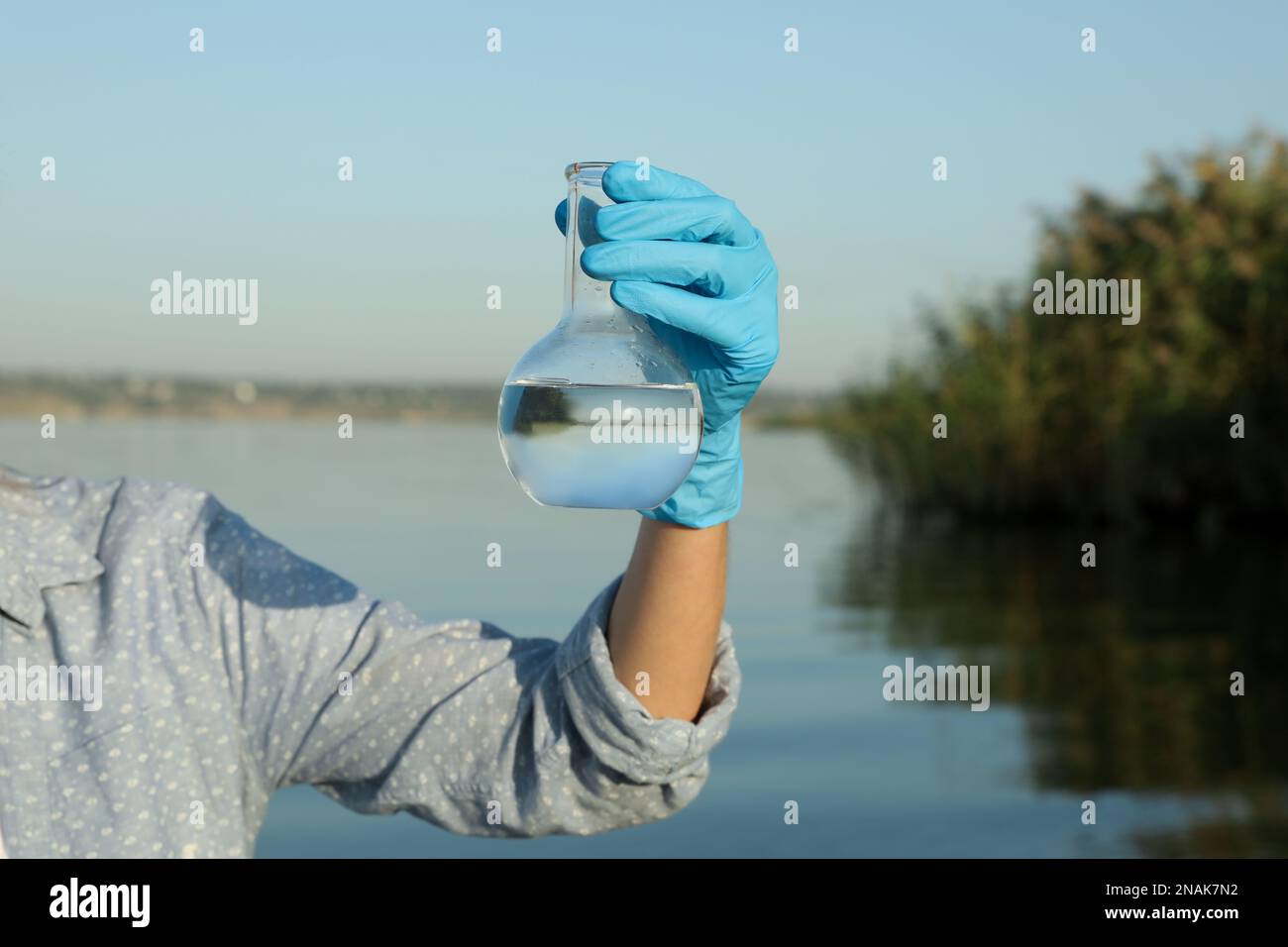 Closeup hand taking sample river hi-res stock photography and images ...