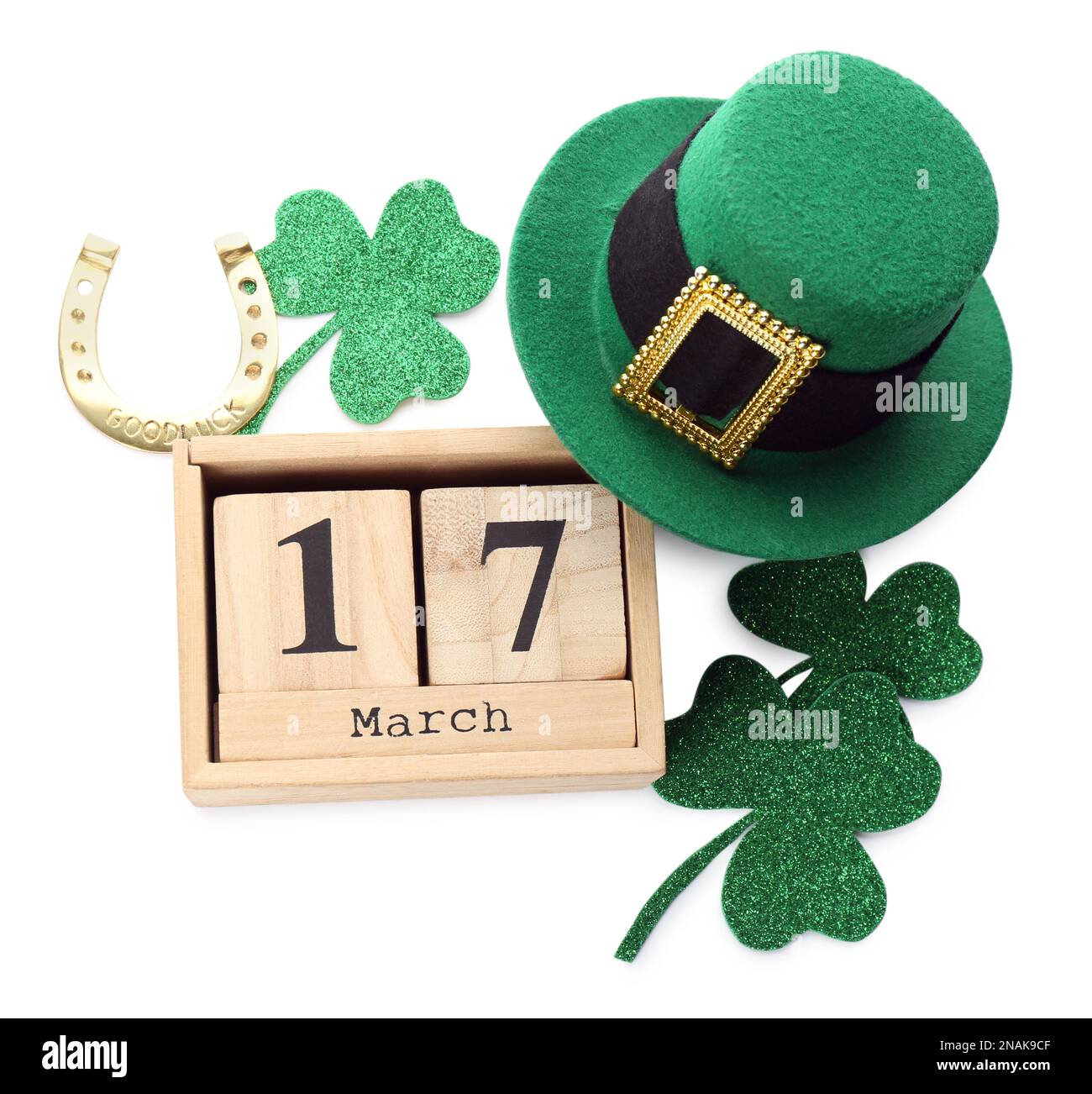 Leprechaun's hat, block calendar and St. Patrick's day decor on white ...