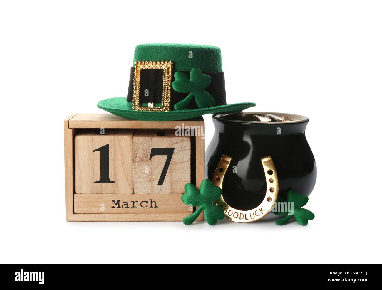 Leprechaun's hat, block calendar and St. Patrick's day decor on white ...