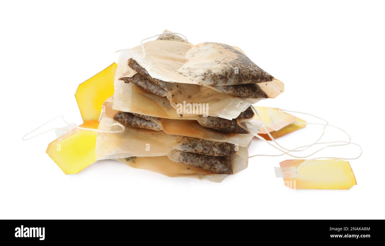 Many used tea bags on white background Stock Photo - Alamy