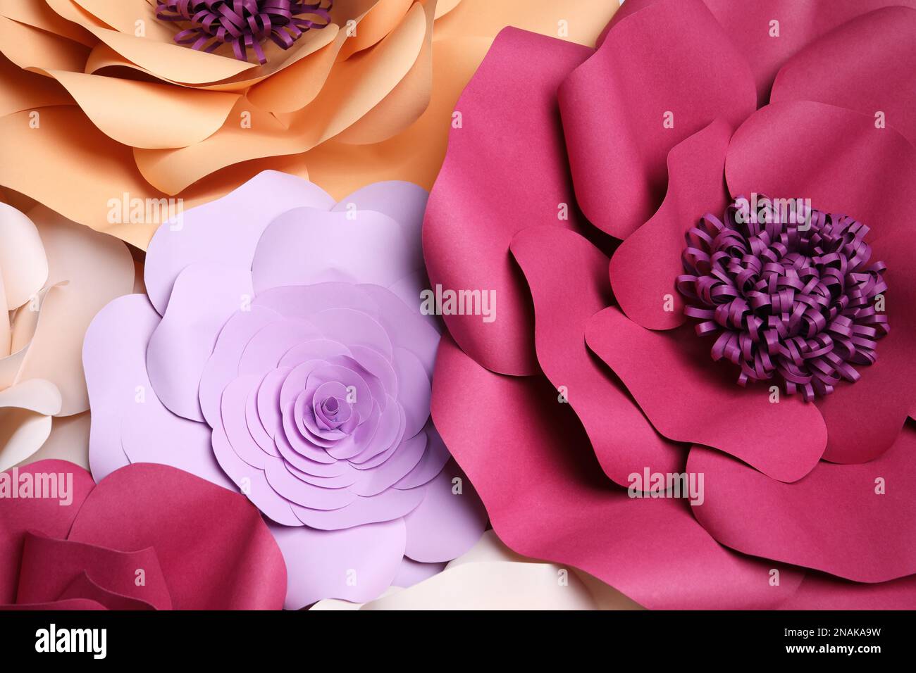 Different beautiful flowers made of paper as background, top view Stock ...