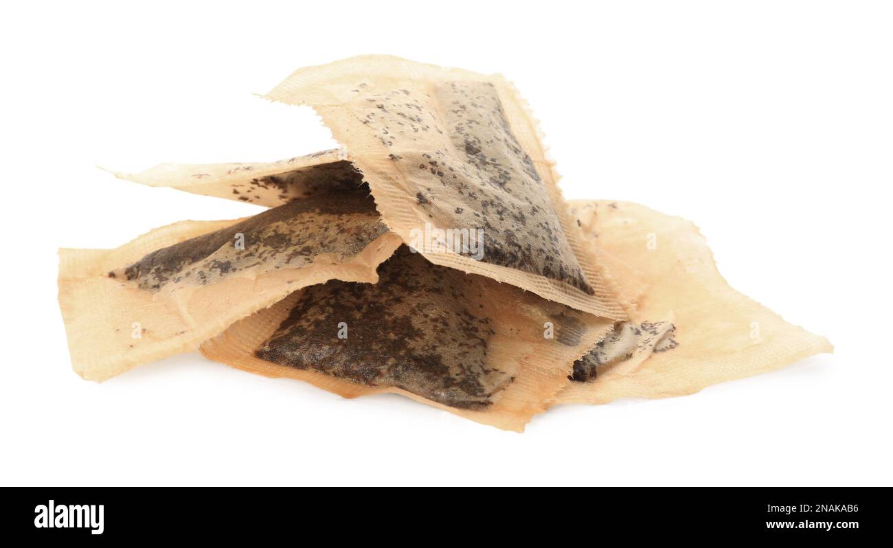 Many used tea bags on white background Stock Photo - Alamy