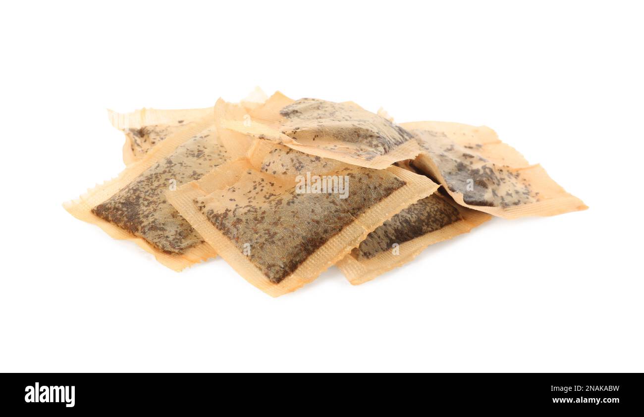 Many used tea bags on white background Stock Photo - Alamy