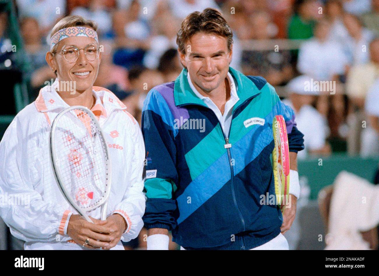Martina Navratilova, left, poses with Jimmy Connors on the court at ...