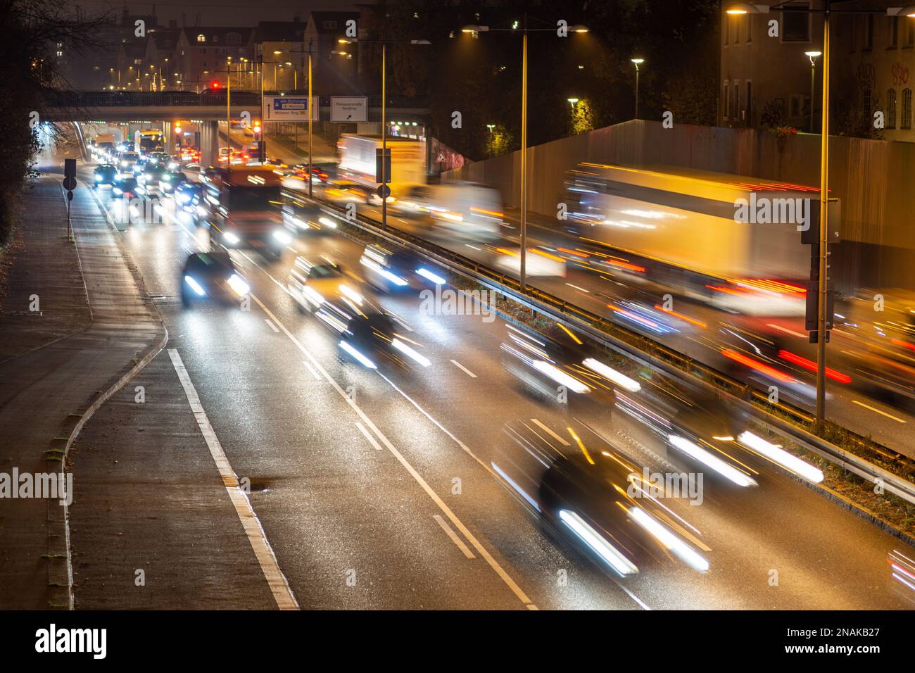 Speeding traffic moves quickly along a city highway in Munich, Germany ...