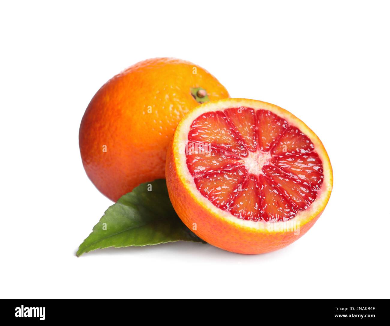 Whole and cut red oranges with green leaf isolated on white Stock Photo ...