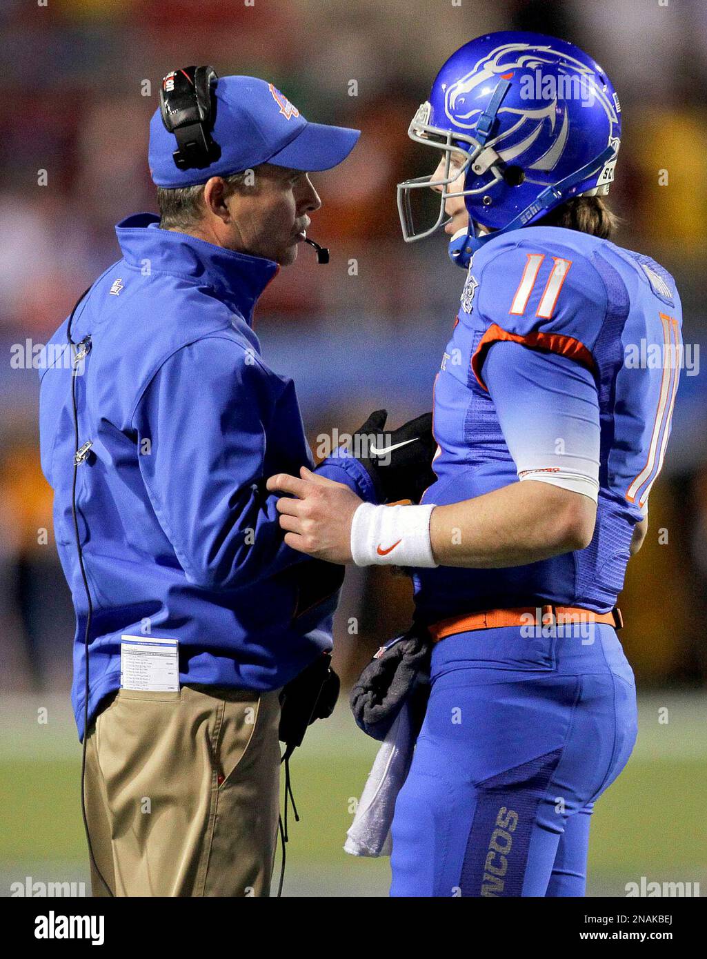 Boise State quarterback Kellen Moore, right, talks with coach Chris ...