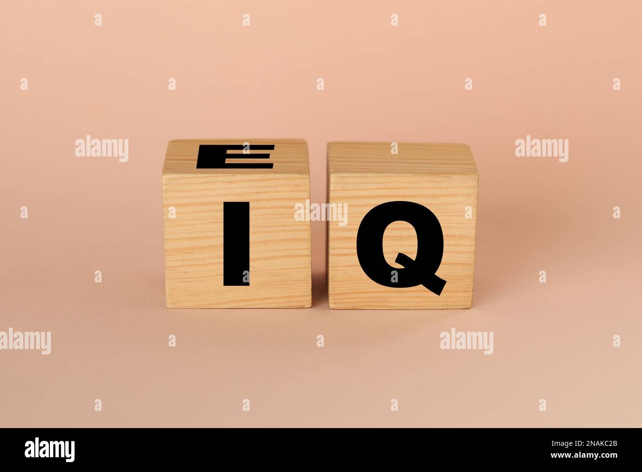 Wooden cubes with abbreviation IQ on beige background Stock Photo - Alamy