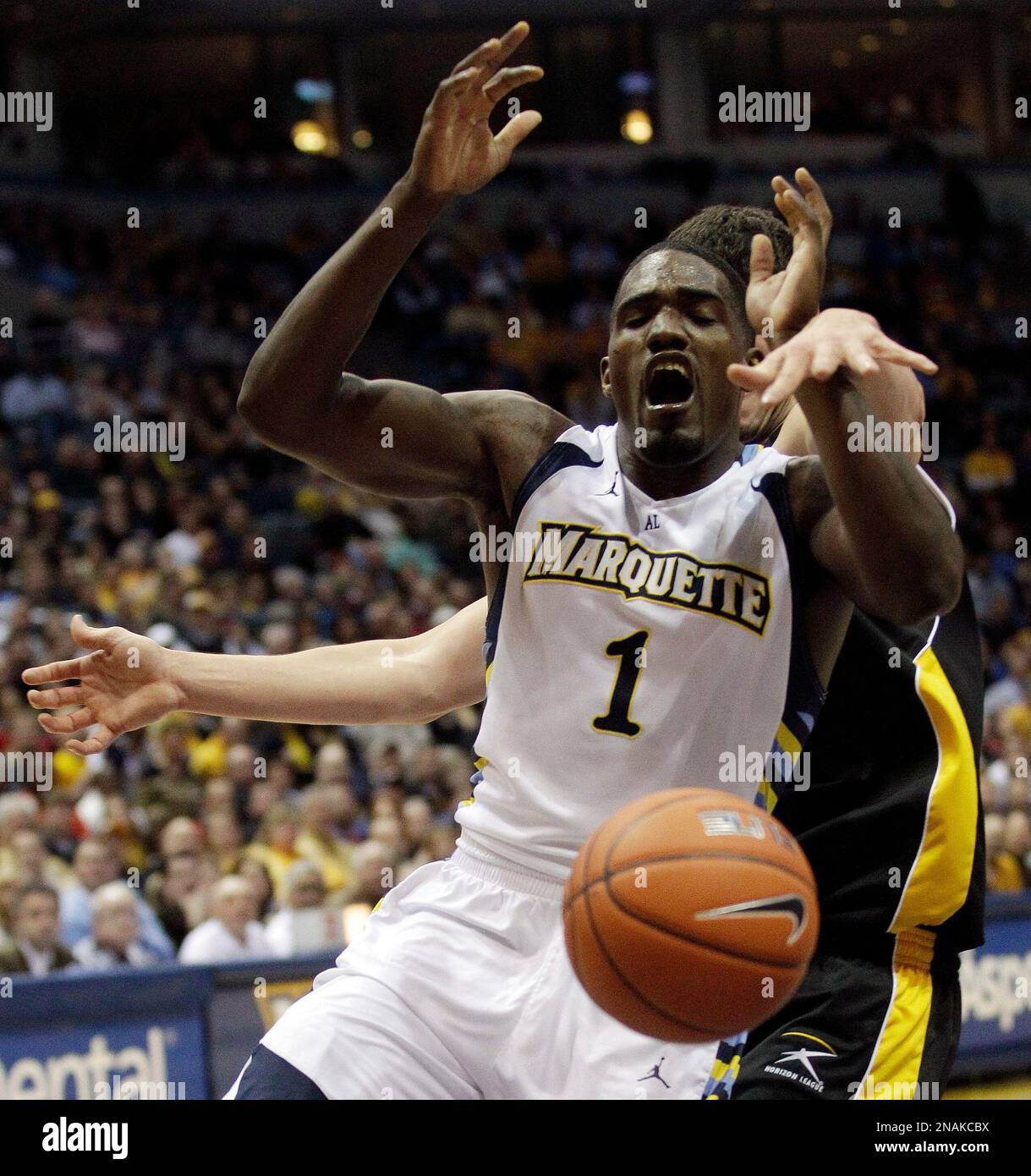 Marquette's Darius Johnson-Odom (1) has the ball stripped away by ...