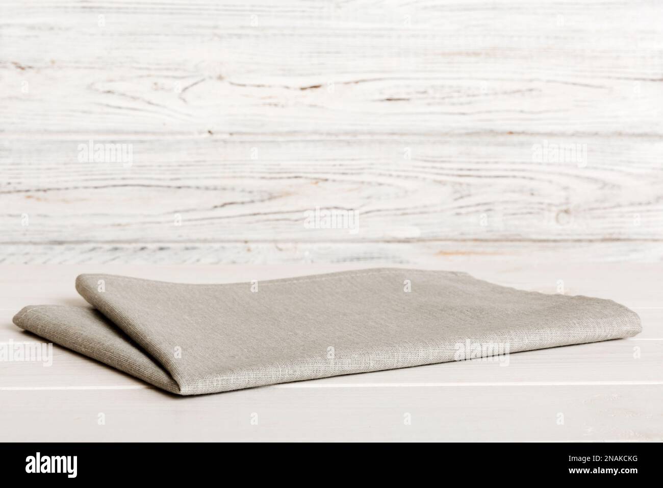 top view with gray kitchen napkin isolated on table background. Folded ...