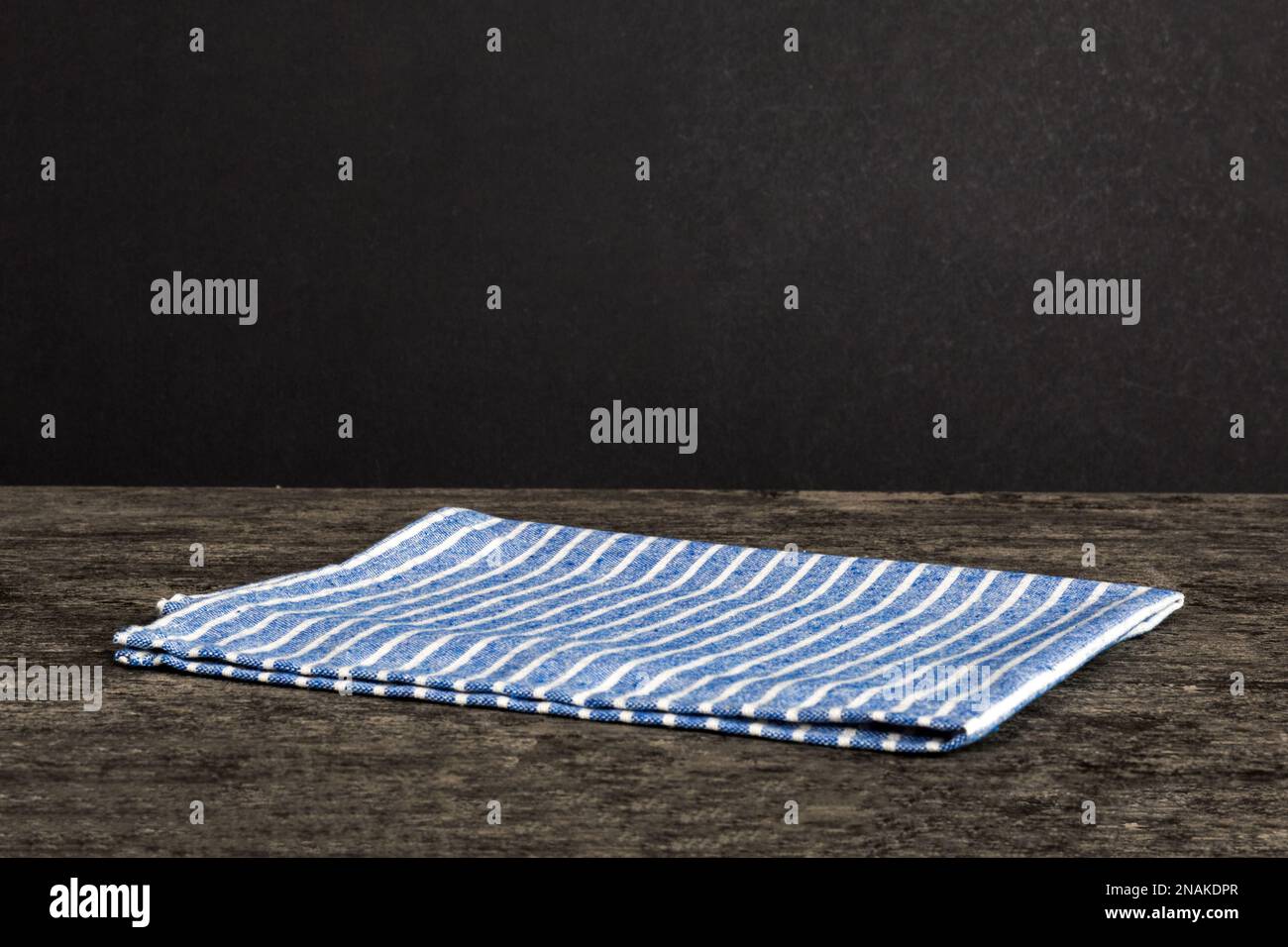 top view with blue kitchen napkin isolated on table background. Folded ...